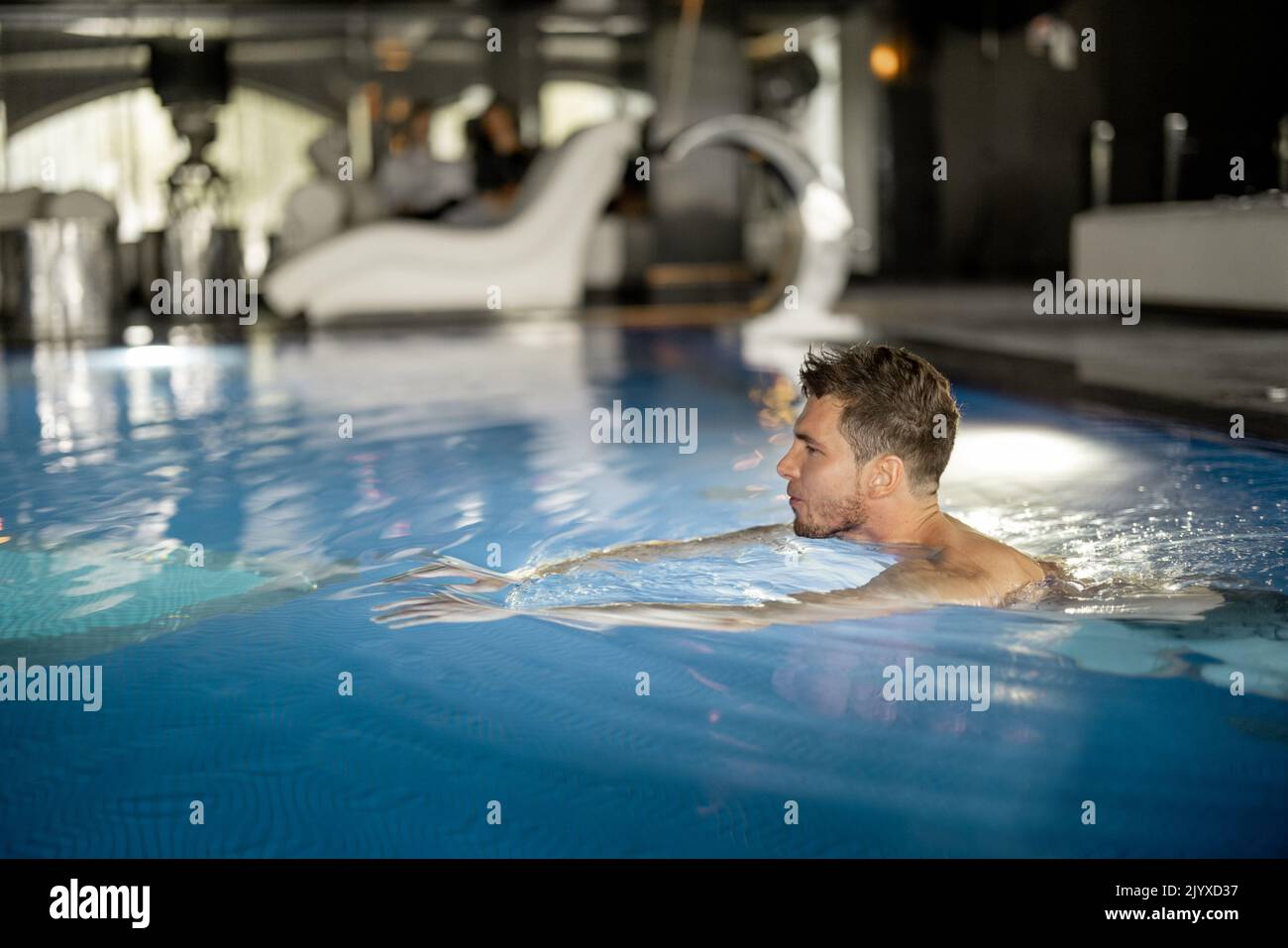 Handsome man in swimming pool hi-res stock photography and images - Alamy