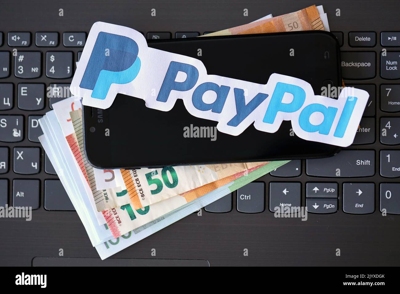 TERNOPIL, UKRAINE - SEPTEMBER 6, 2022 Paypal paper logotype lies on ...