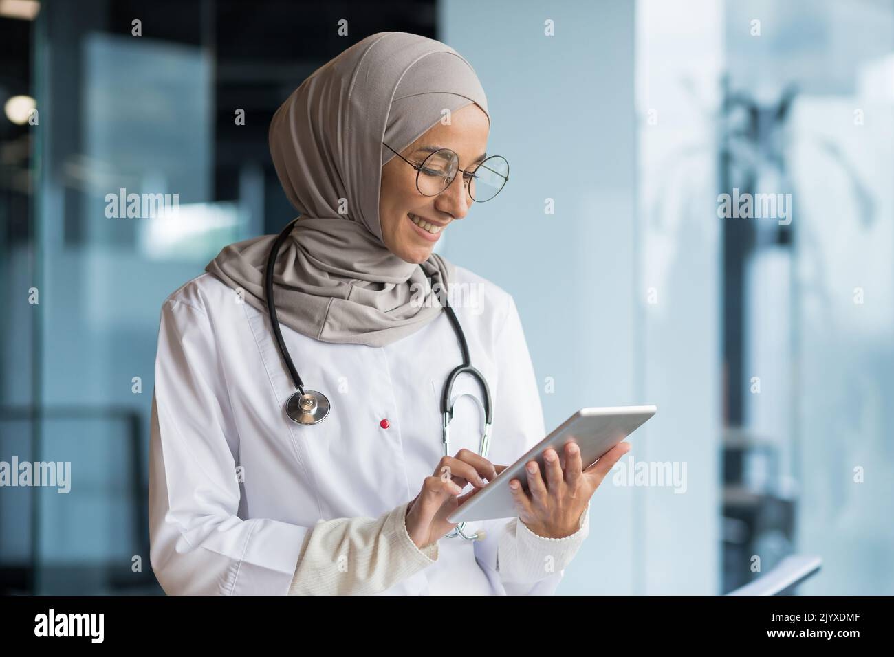 Female doctor in hijab works in modern clinic office, Muslim female ...