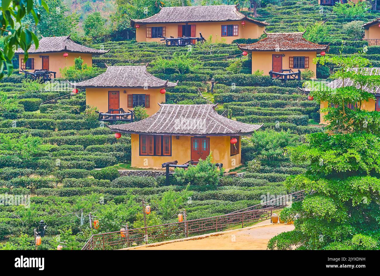 The picturesque adobe Chinese houses with sweeping roofs, red paper ...