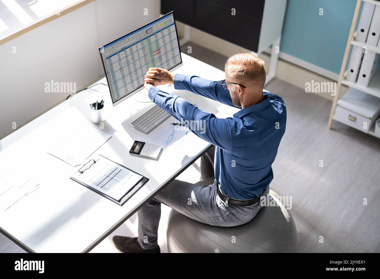 Man stretching arms overhead hi-res stock photography and images - Alamy