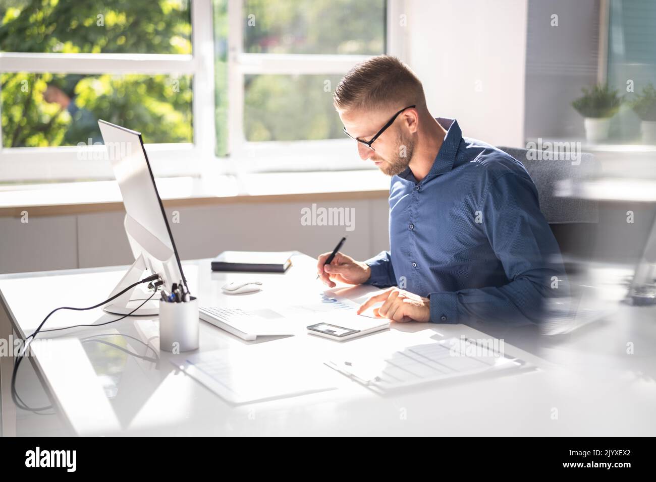 Accountant Using E Invoice Software At Computer In Office Stock Photo ...