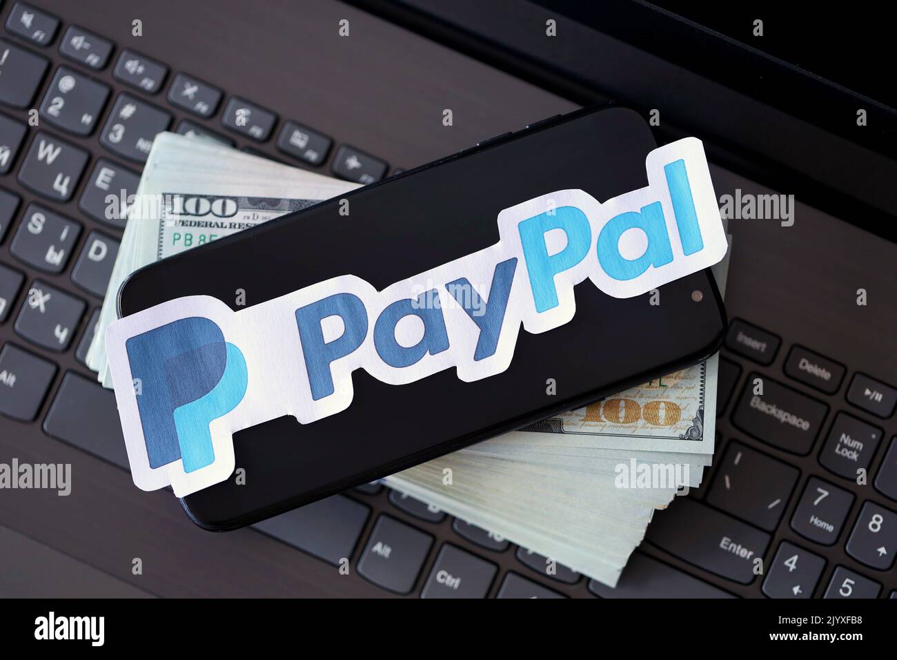 TERNOPIL, UKRAINE - SEPTEMBER 6, 2022 Paypal paper logotype lies on ...