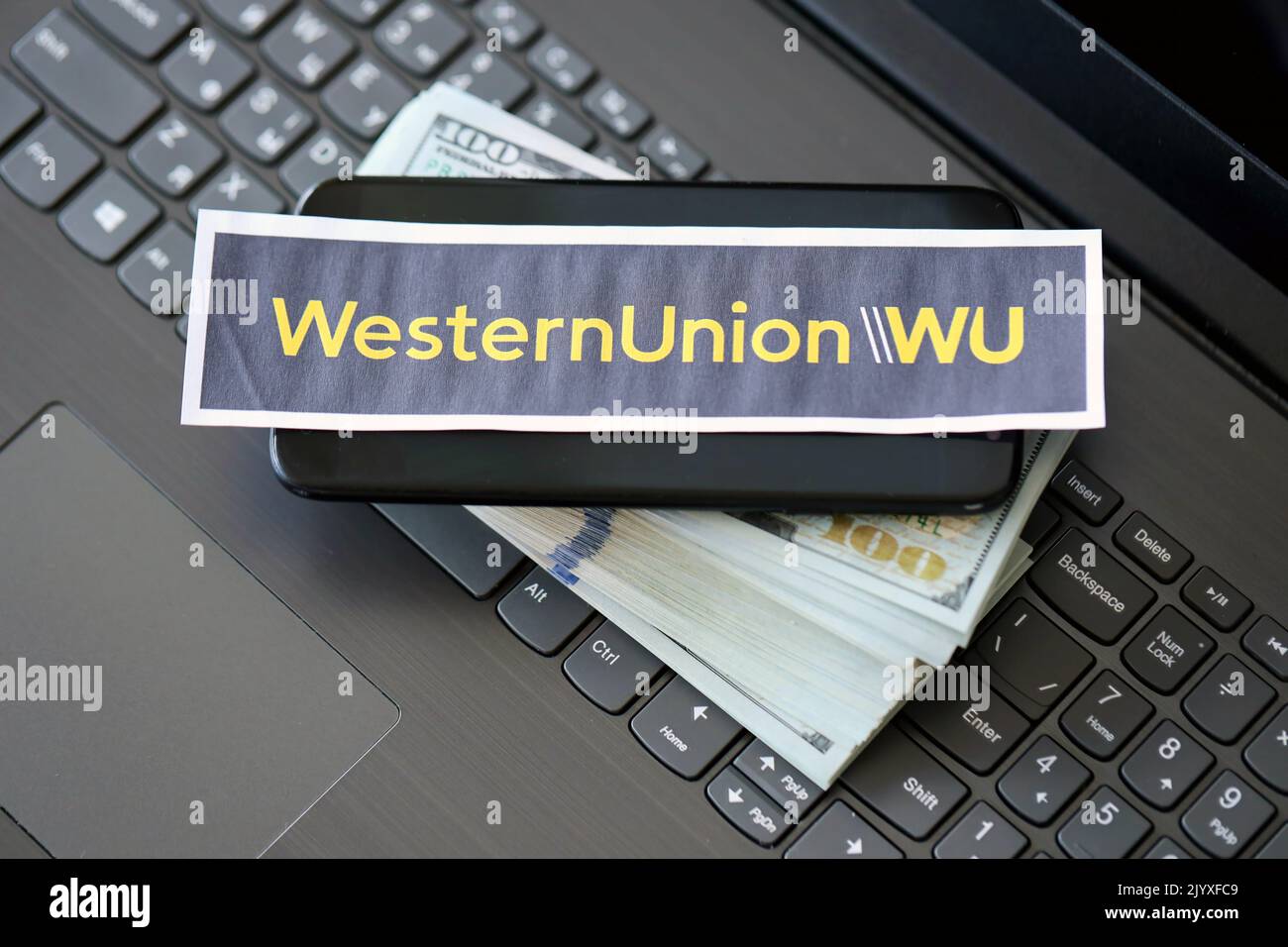 TERNOPIL, UKRAINE - SEPTEMBER 6, 2022 Western Union paper logotype lies ...