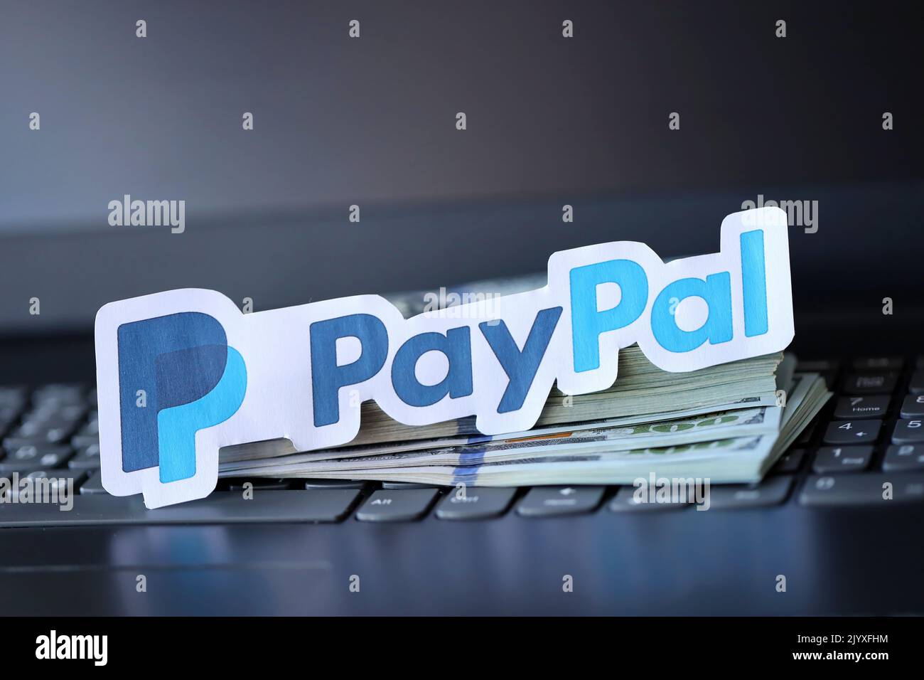 TERNOPIL, UKRAINE - SEPTEMBER 6, 2022 Paypal paper logotype lies on ...