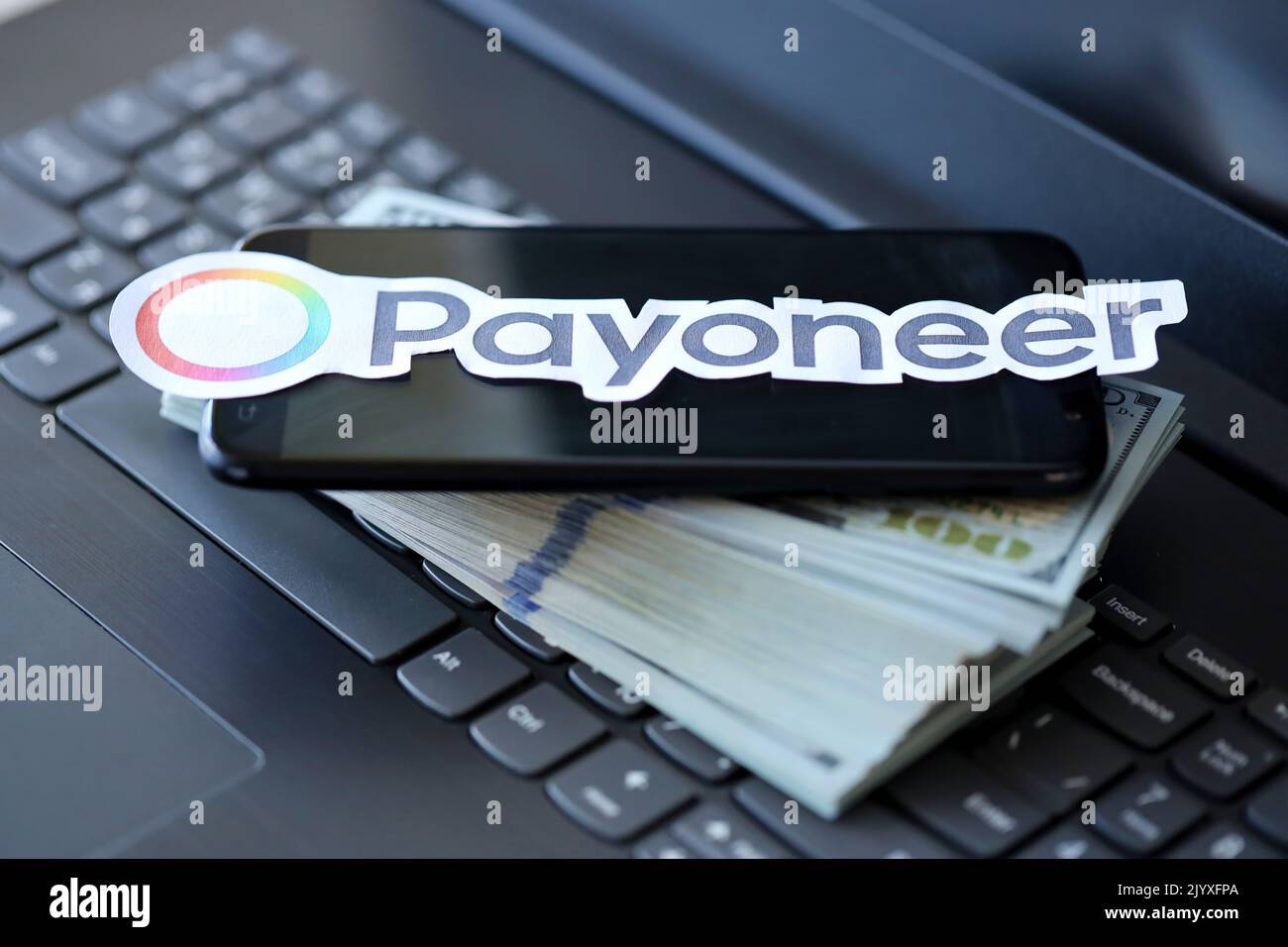 TERNOPIL, UKRAINE - SEPTEMBER 6, 2022 Payoneer paper logotype lies on black laptop keyboard with ...