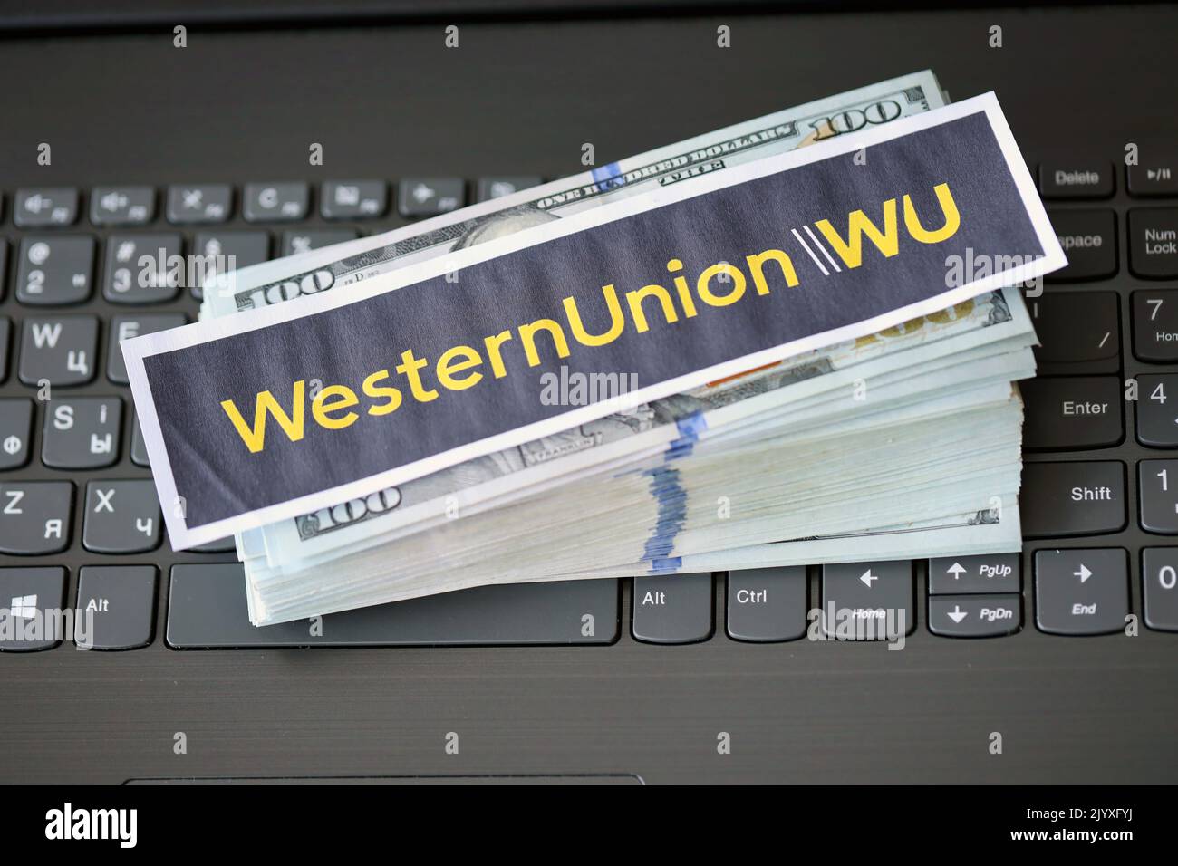 TERNOPIL, UKRAINE - SEPTEMBER 6, 2022 Western Union paper logotype lies ...