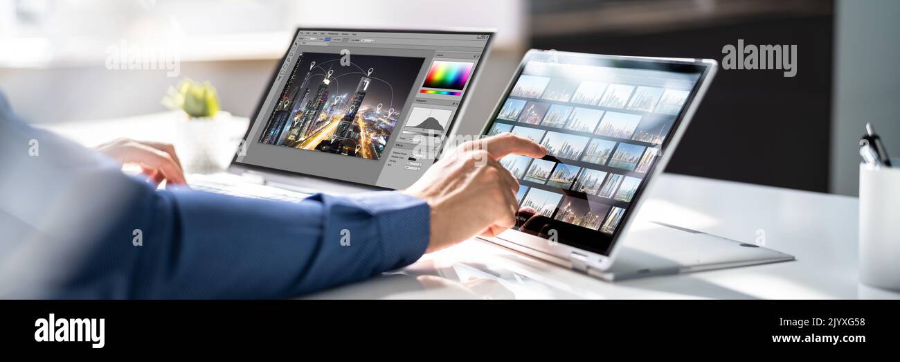 Graphic Designer Editing Photo On Laptop Computer Stock Photo - Alamy