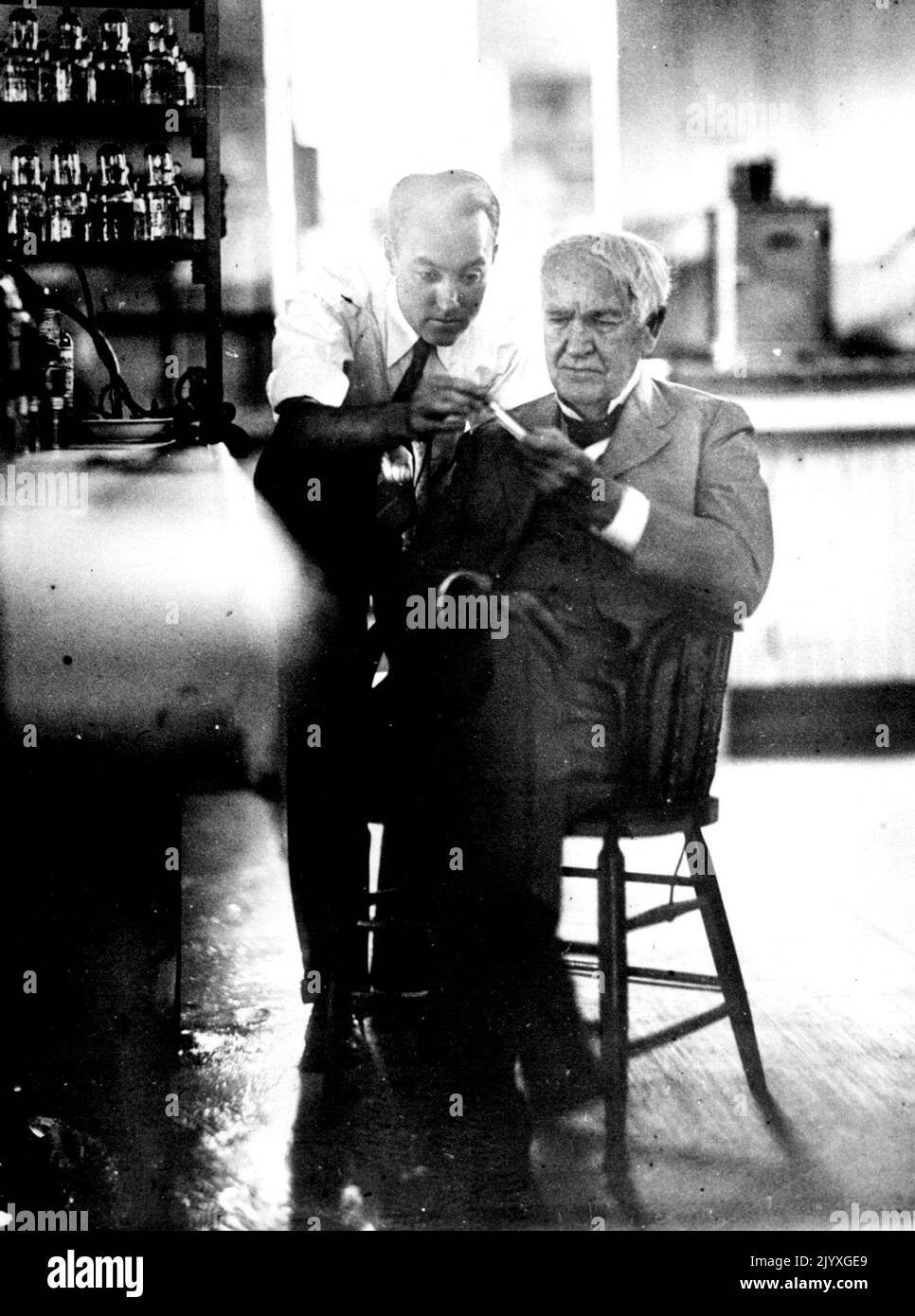 Candid Camera's Eye Sees Great Inventor ***** In Work In Laboratory ...