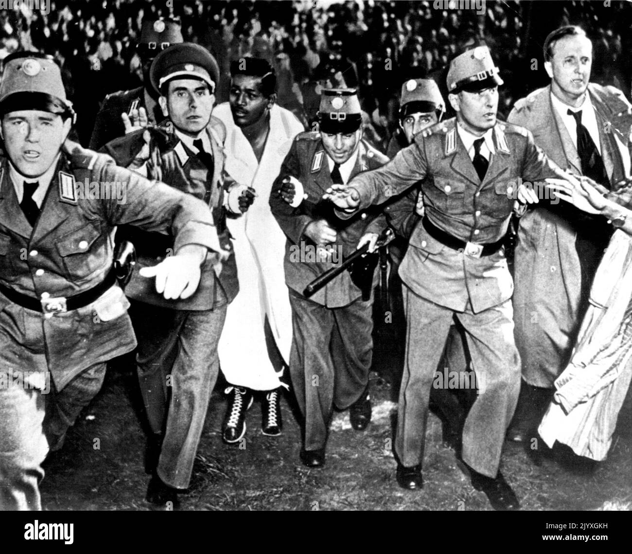 Robby Rushed TO Safety -- Sugar Ray Robinson (white robe), world ...