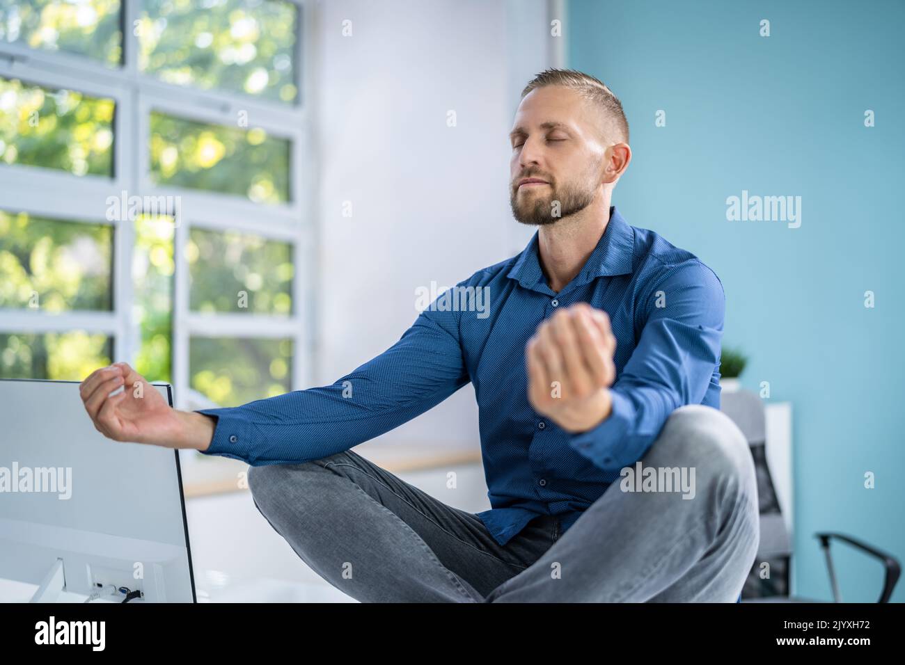 Employee Doing Mental Health Yoga Meditation In Office Stock Photo - Alamy