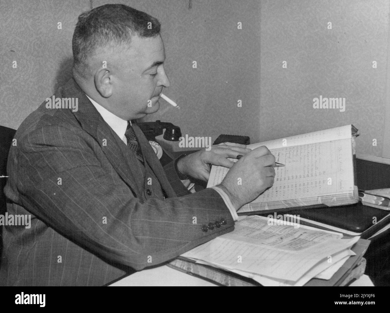 Mr E.S. Spooner smoking his last cigarette ***** end of election ...