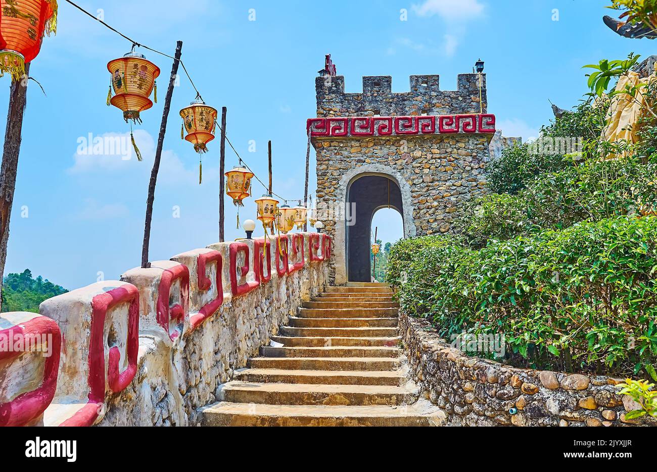 The stone rampart with decorative battlements and the watchtower with ...