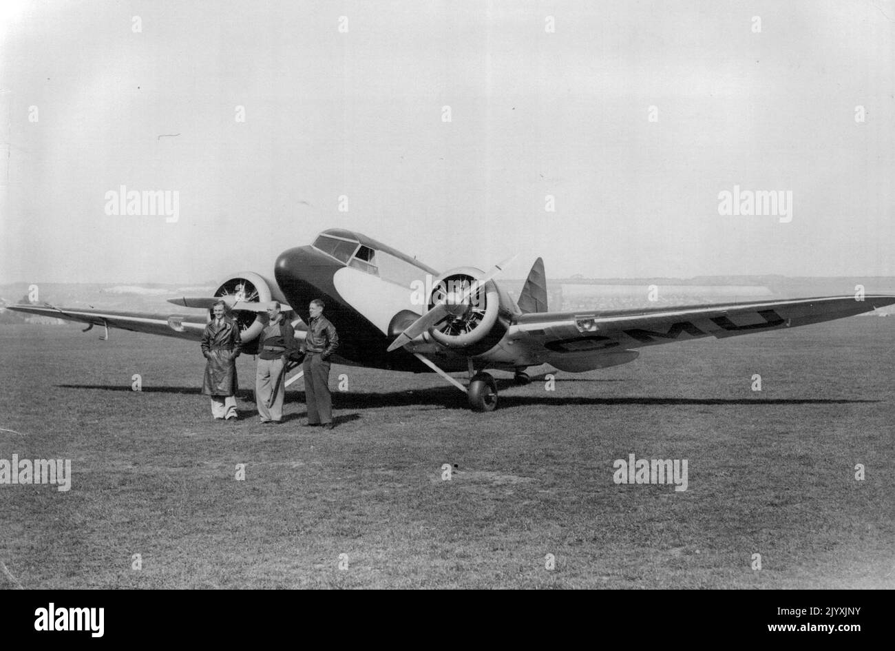 Capt. T. Neville Stack, the famous airman, inspects his new racing ...