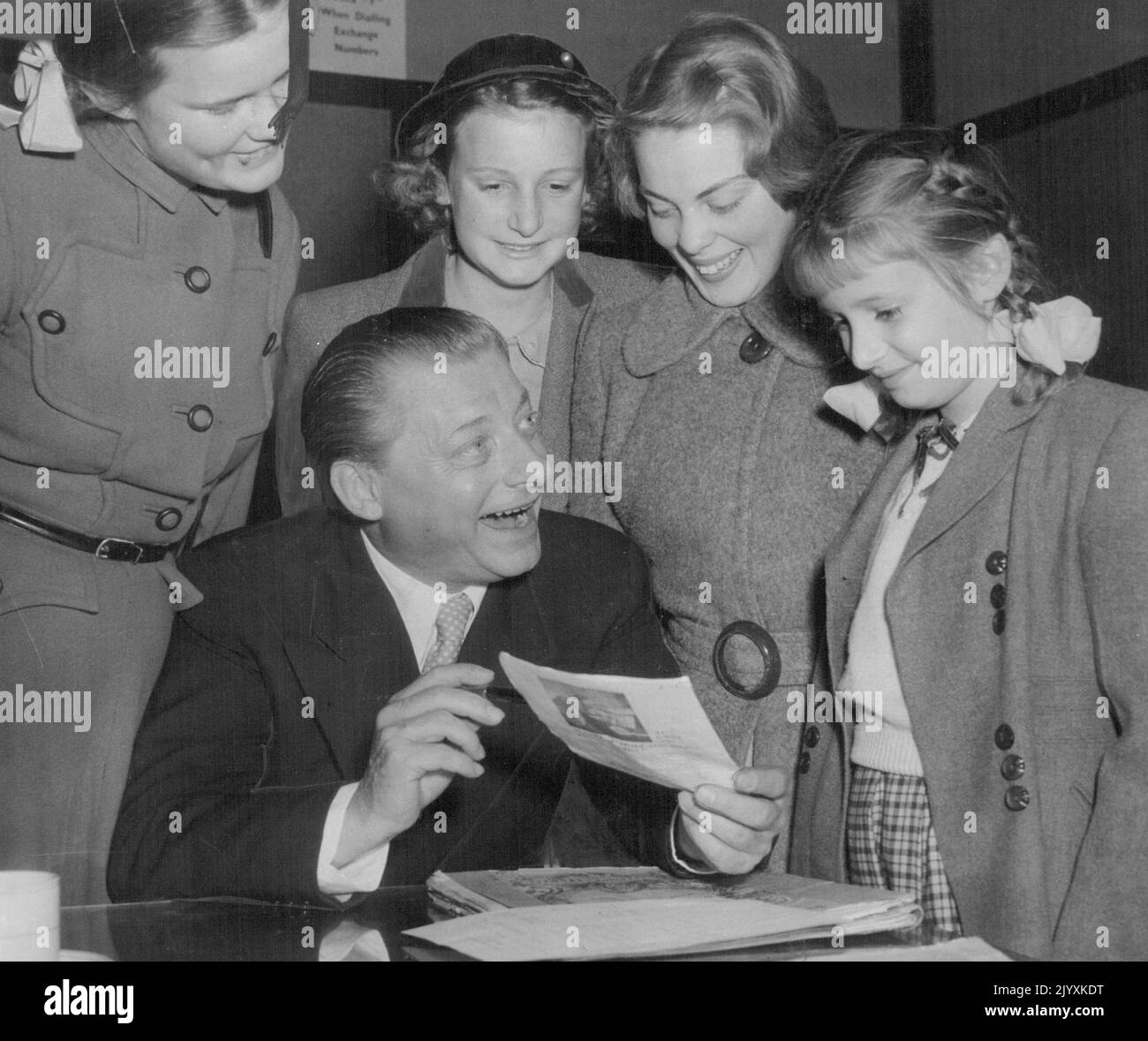 Dr. Hans Schmidt-Isserstedt, visiting German conductor, explains the ...