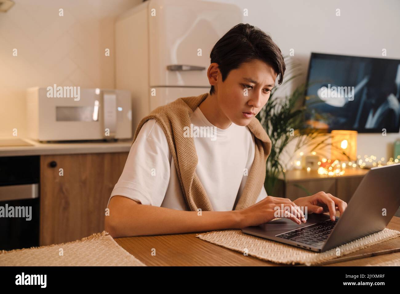 Asian teen boy laptop hi-res stock photography and images - Alamy