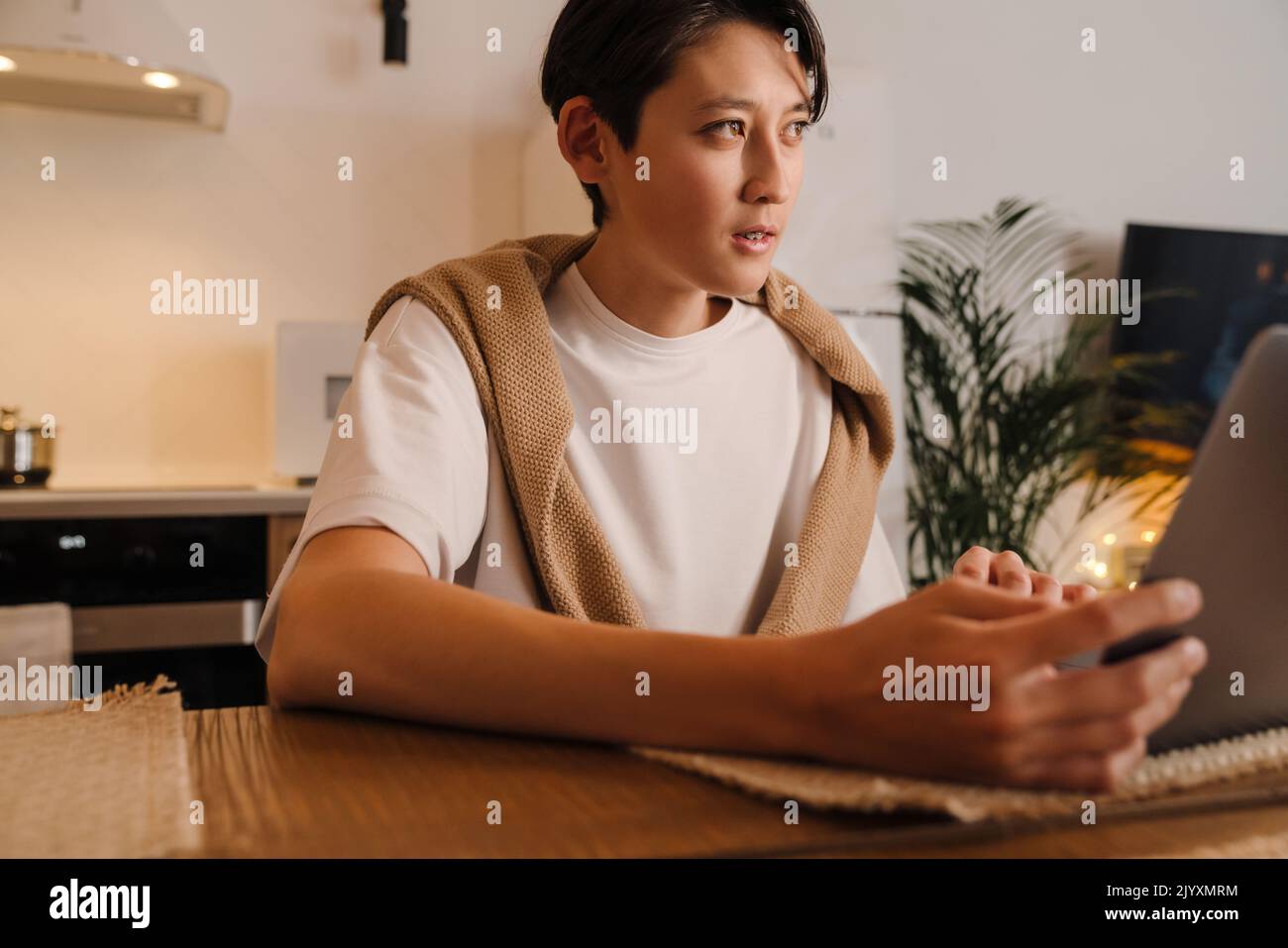 Asian teen boy laptop hi-res stock photography and images - Alamy