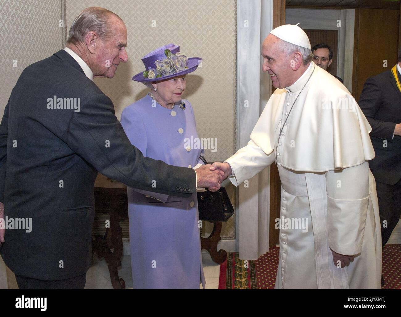 File photo dated 03/04/14 of the Duke of Edinburgh shaking hands with ...