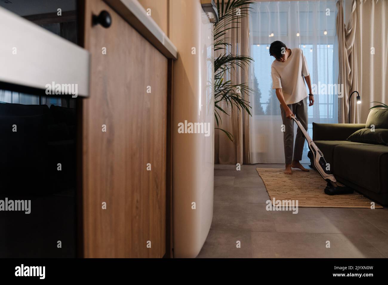 Boy doing housework hi-res stock photography and images - Alamy