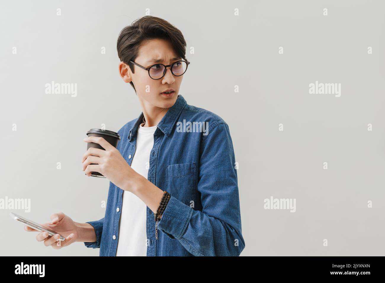 Teen boy coffee phone indoors hi-res stock photography and images - Alamy