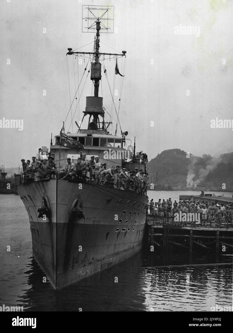 H.M.A.S. ***** comes alongside a jetty in Yokosuka, one of the first ...