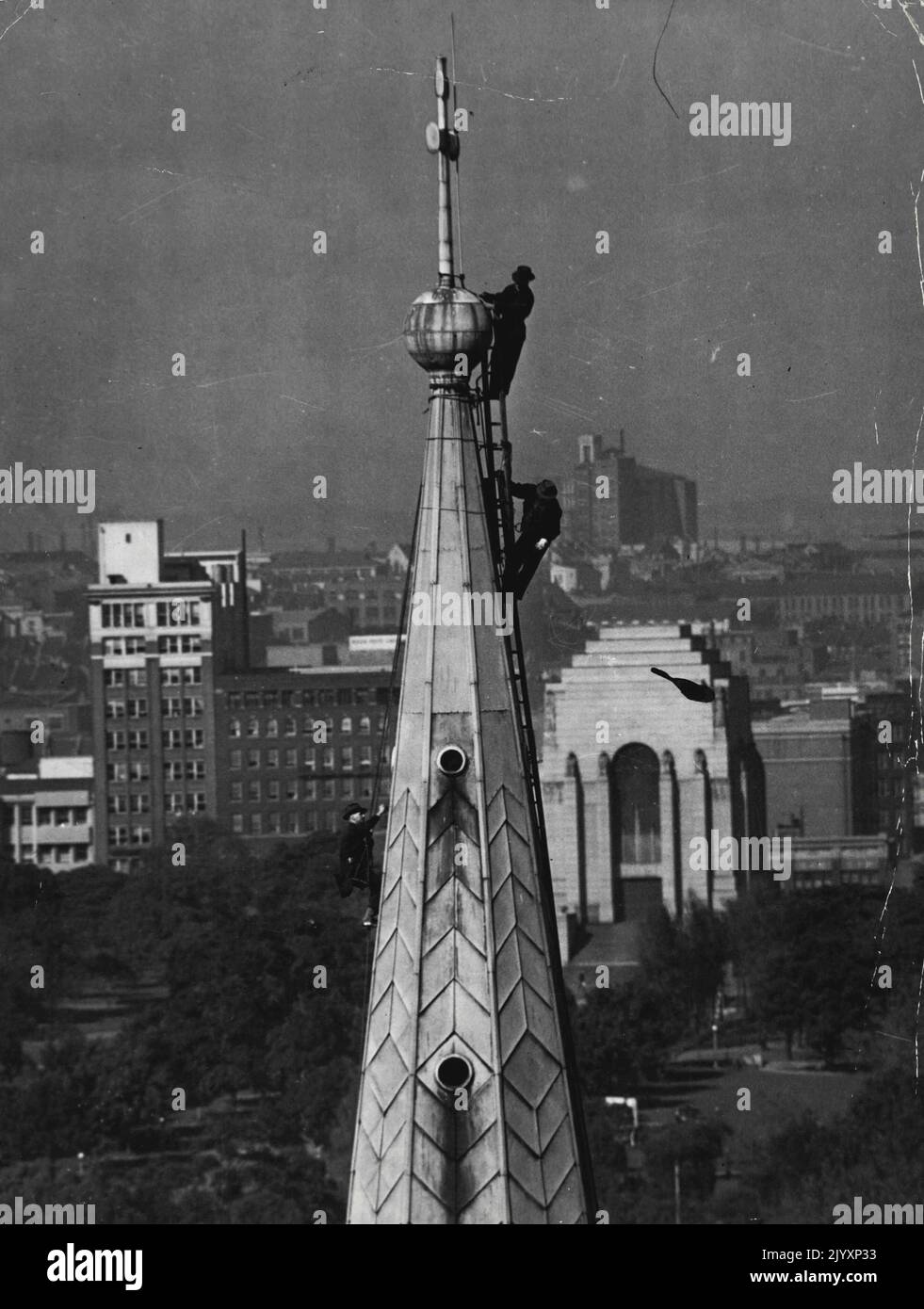 Charles and Sons Steelepjacks inspecting storm damage to the spire of ...