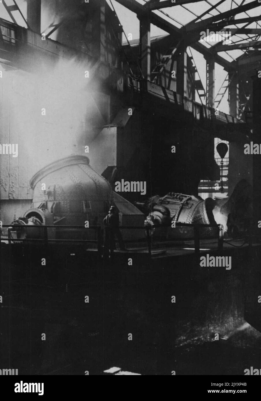 Going full blast is this steel-producing: Bessemer converter. February ...