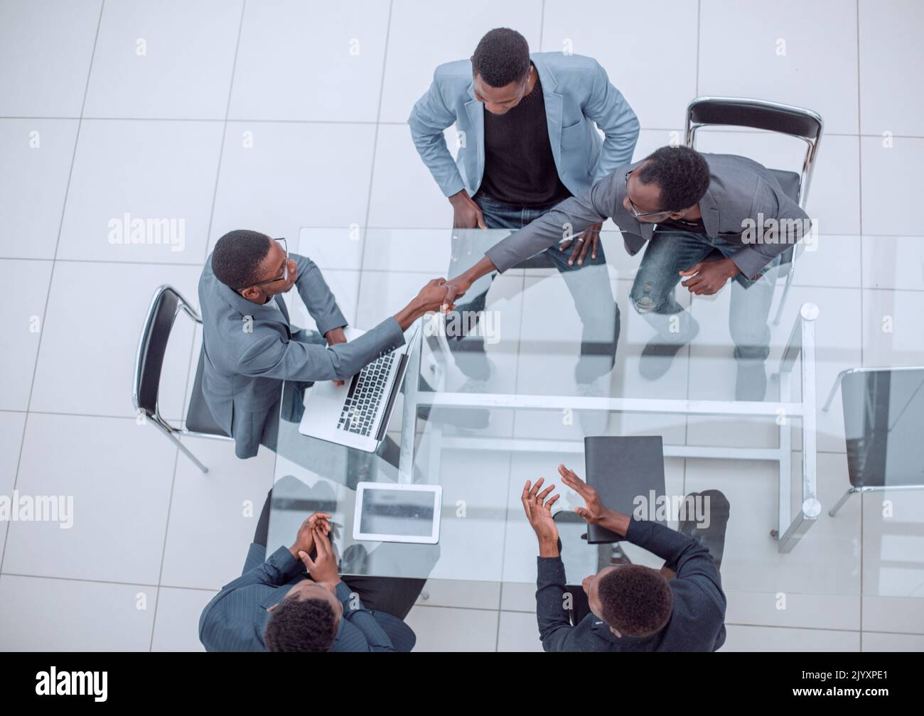 business partners shaking hands during negotiations in the office Stock ...