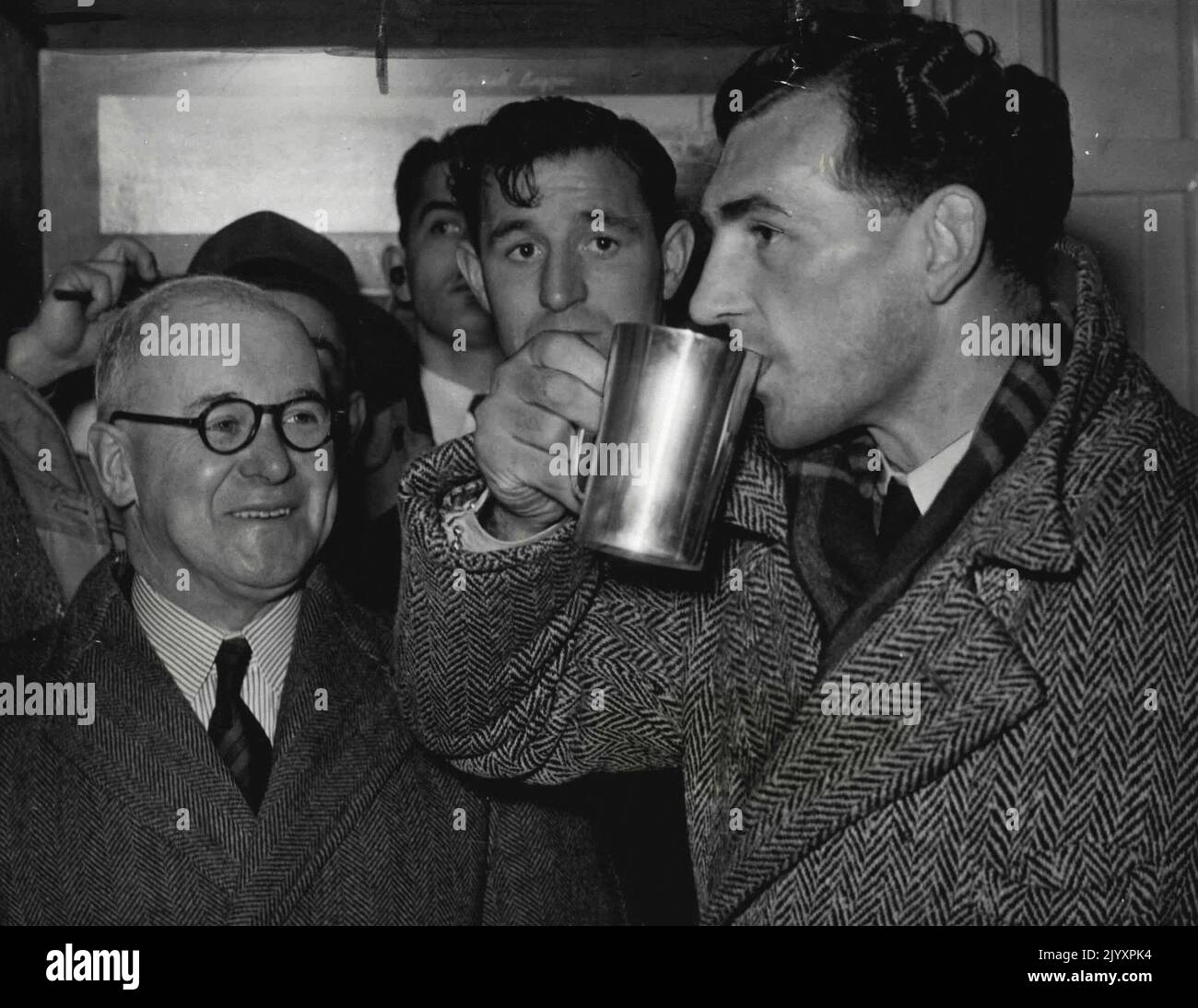 English Rugby League Captain Gus Risman takes a drink from the Claude ... English Rugby League Captain Gus Risman takes a drink from the Claude ...