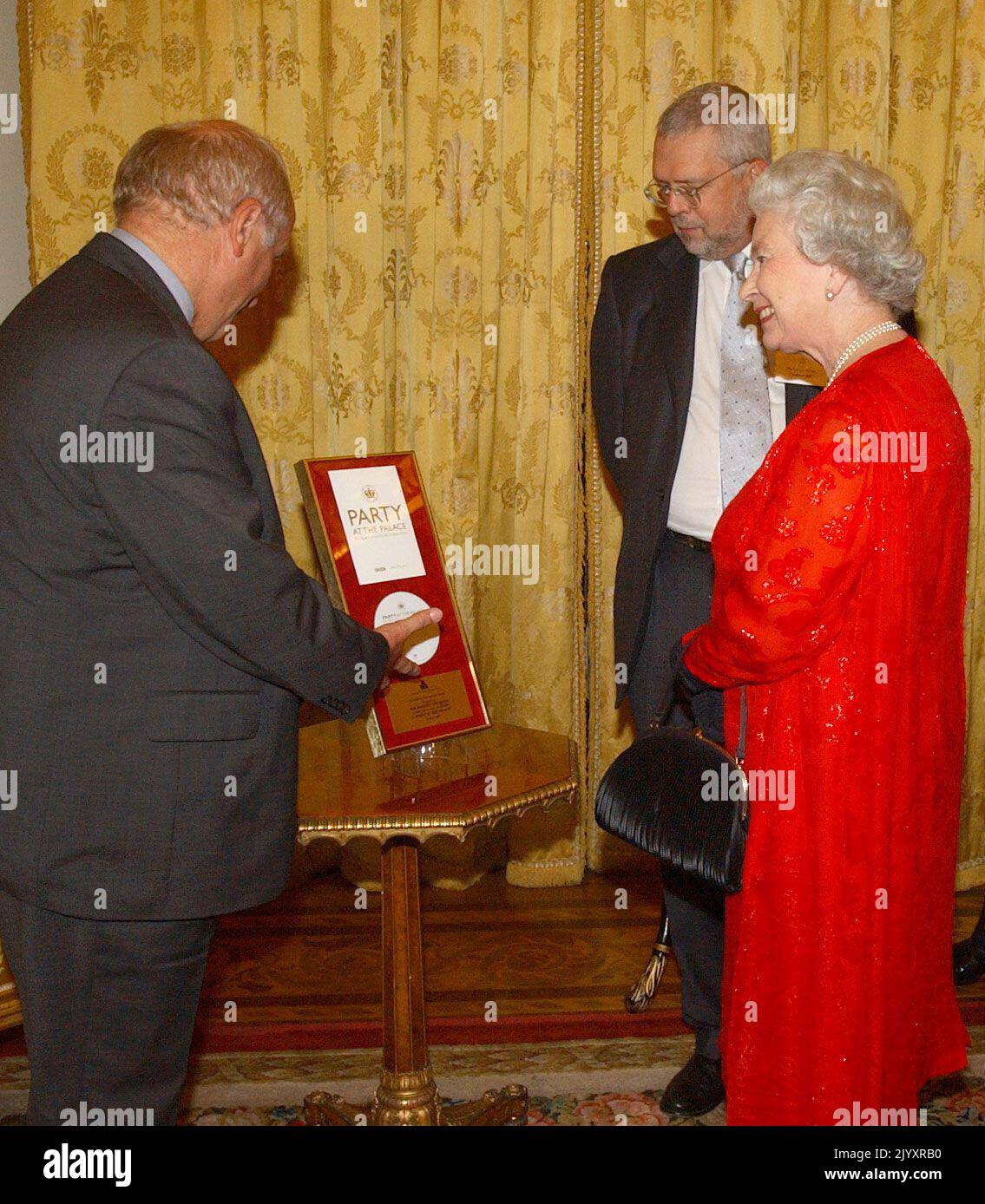File photo dated 30/10/2002 of Queen Elizabeth II being presented with ...