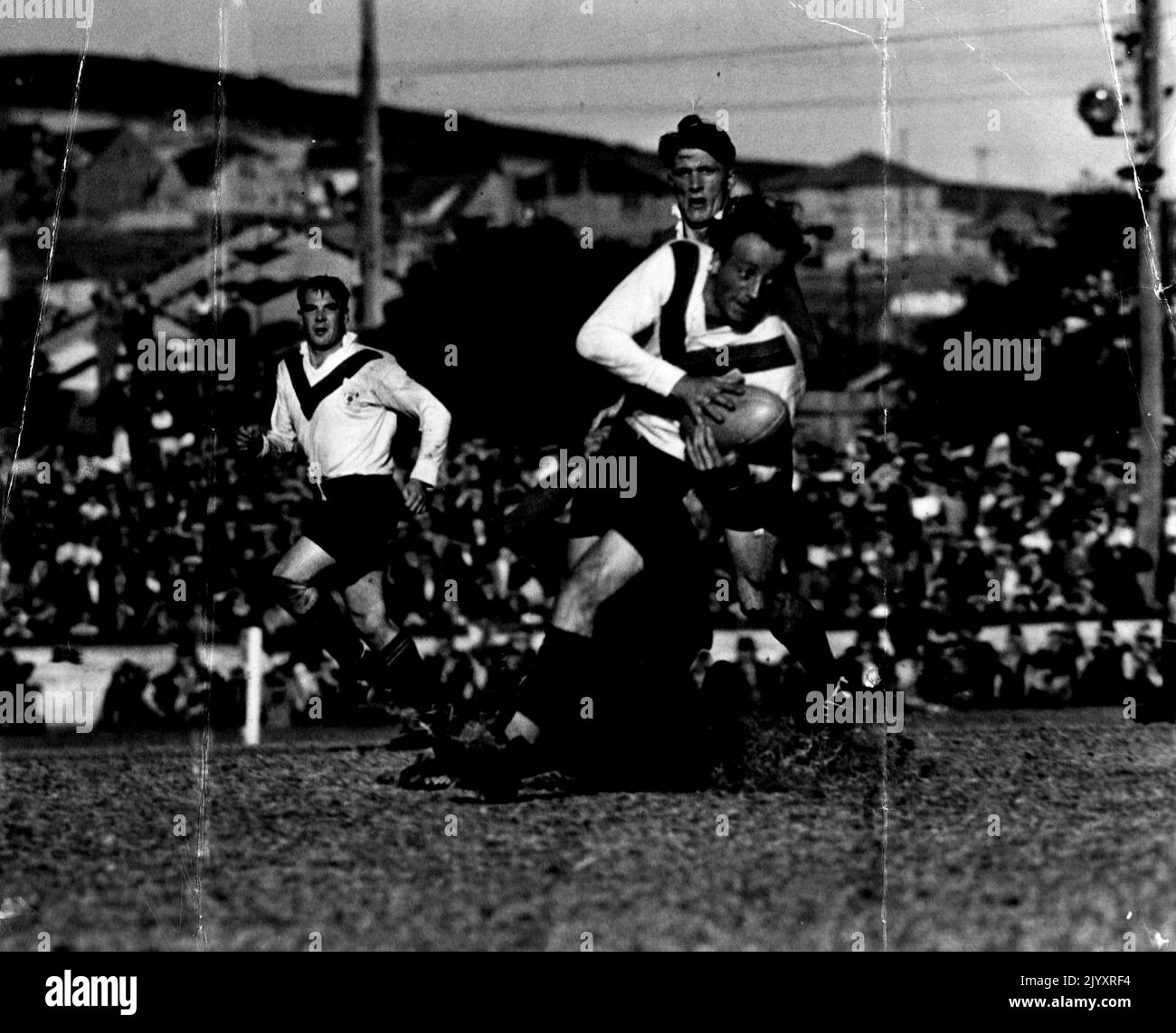 English winger Albert Johnson is well held by a Newcastle opponent but ...