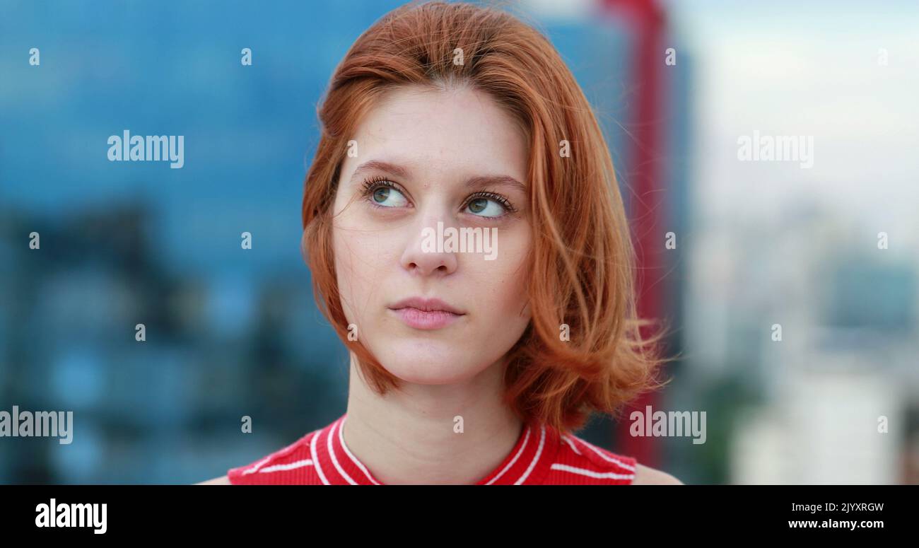 Woman with a bored emotion on face. Redhead girl rolling eyes Stock ...