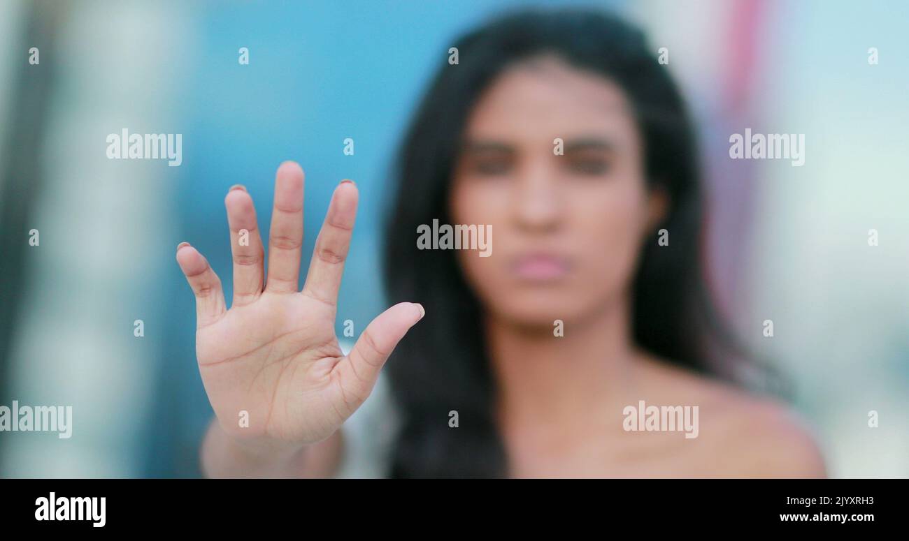 Woman with her hand extended signaling to stop. Black African woman ...