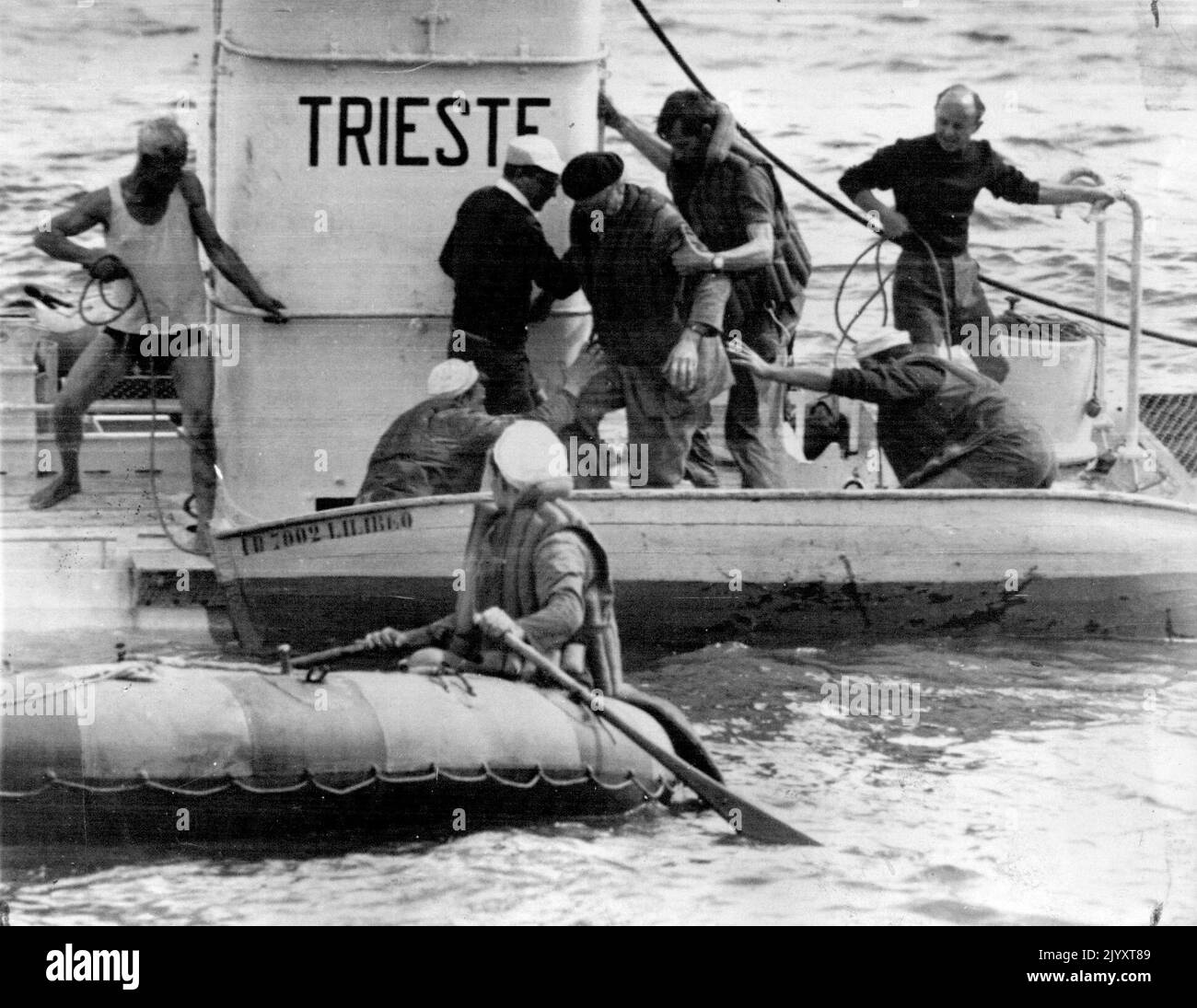 Aided by his 6ft 7in son Jacques he boards a dinghy on their return ...