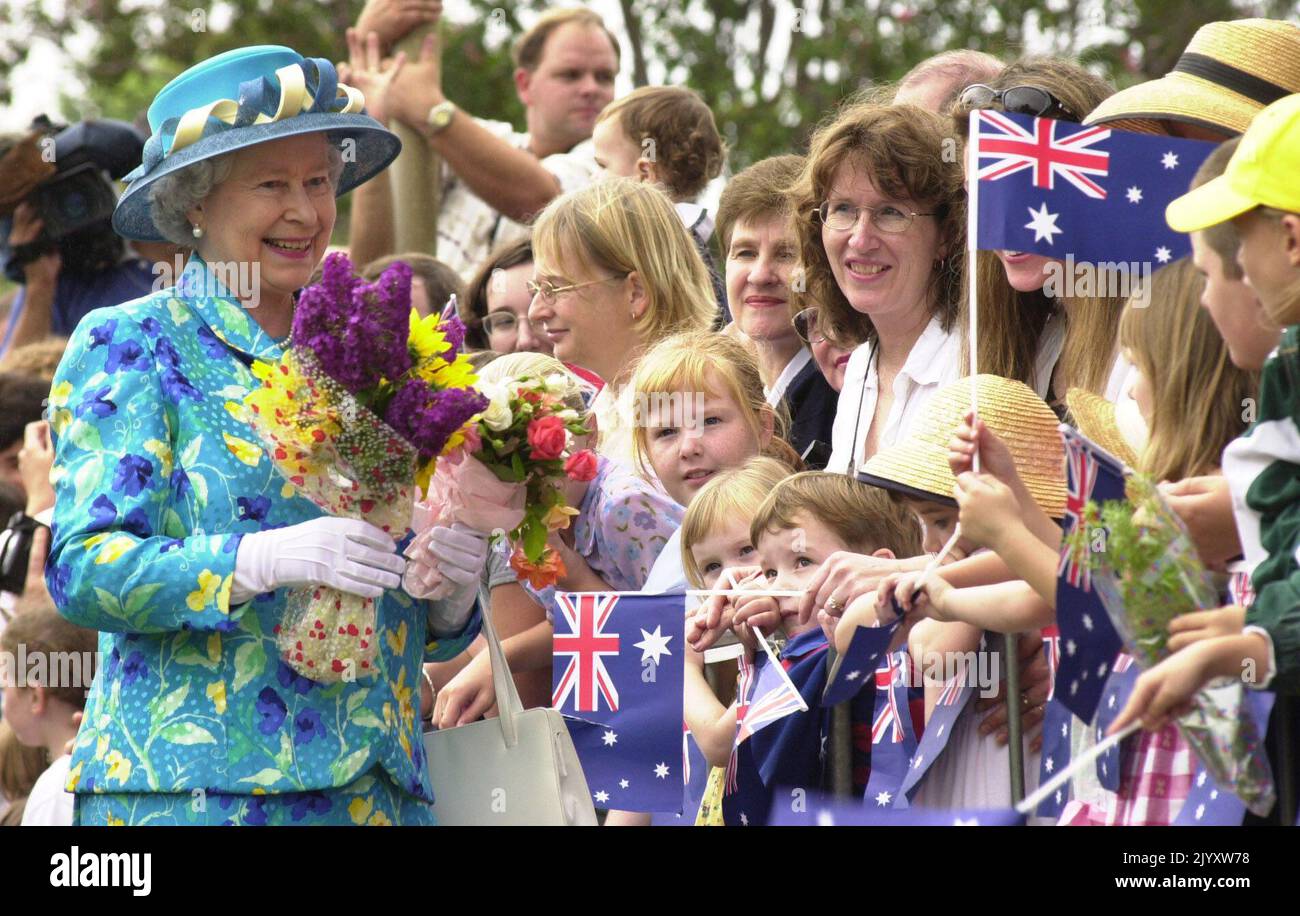 File photo dated 22/3/2000 of Queen Elizabeth II receiving flowers from ...