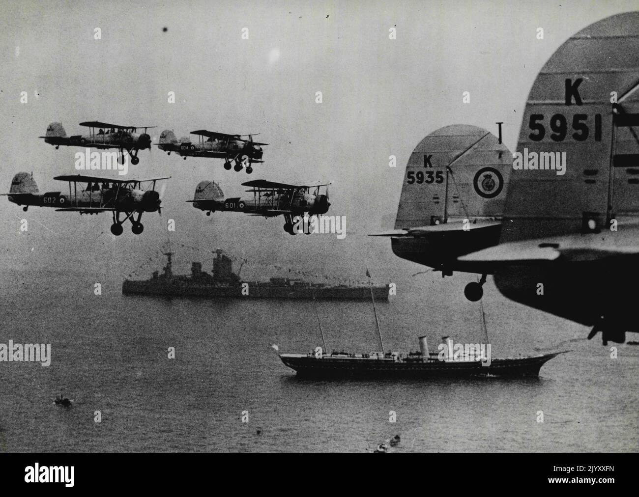 The King Reviews His Fleet - The Royal Yacht, "Victoria and Albert" passing an English ...