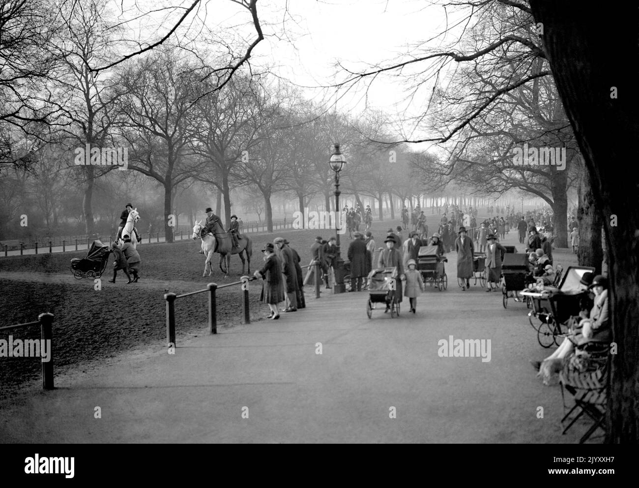 1928: File photo dated January 1928 of people riding horse and pushing ...