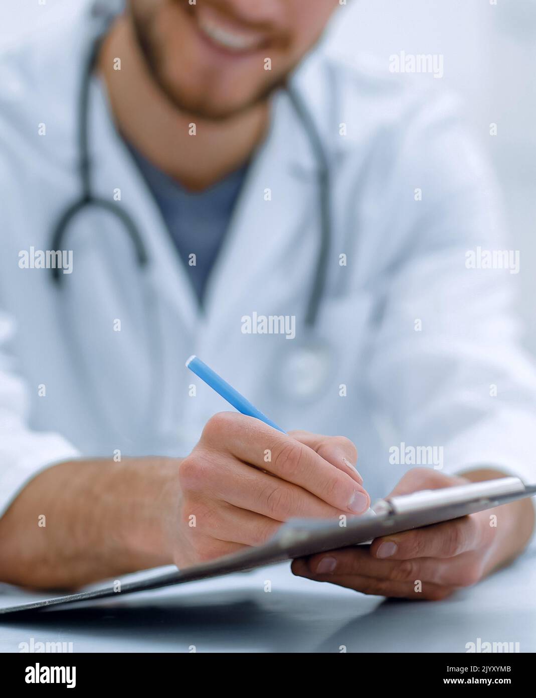 Doctor writing out medical recipe hi-res stock photography and images ...