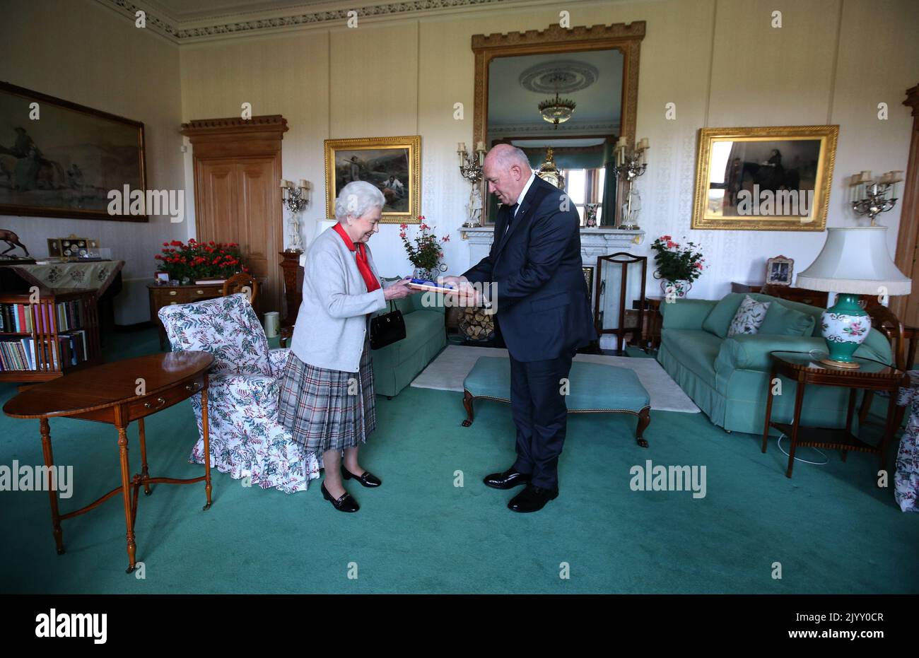 File photo dated 5/8/2014 of Queen Elizabeth II conferring the honour ...