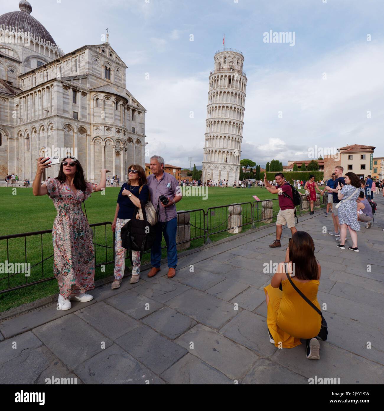 Square of Miracles in Pisa, Tuscany, Italy. Tourists pose for photos in ...