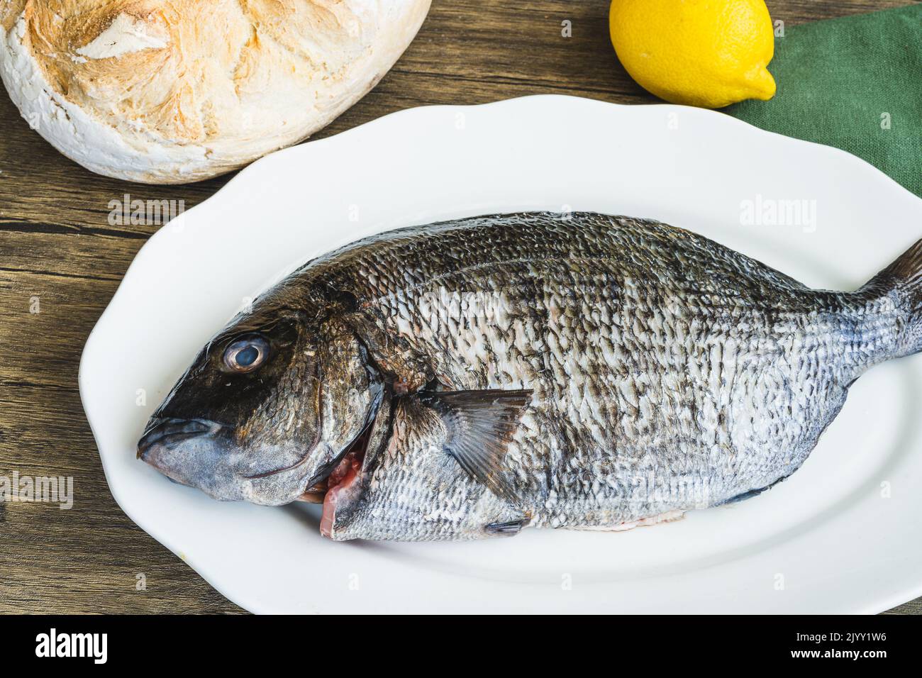 Fresh chop. Tasty fish on white plate Stock Photo - Alamy