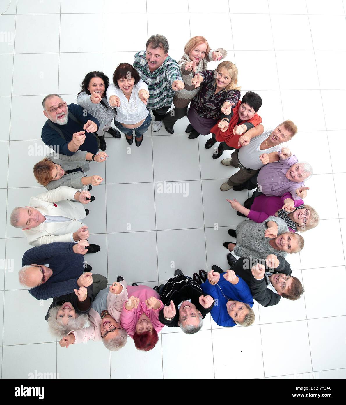 group of smiling mature people pointing at you Stock Photo - Alamy