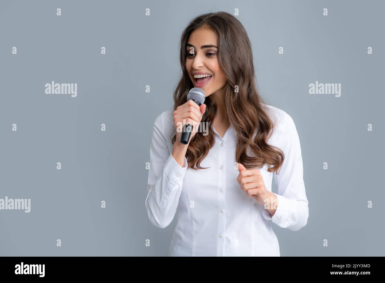 Journalist girl holding a microphone hi-res stock photography and ...
