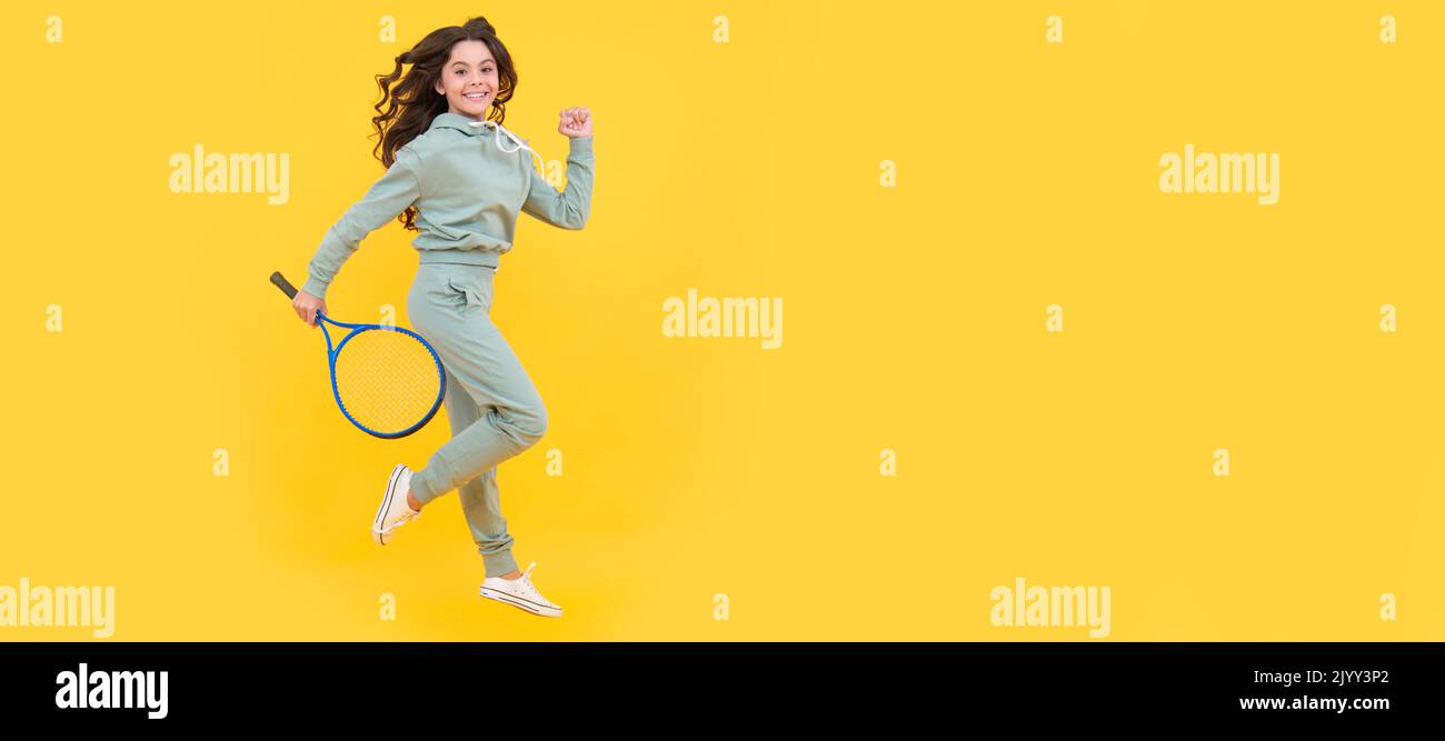 happy energetic kid jump in sportswear with squash racquet running to ...