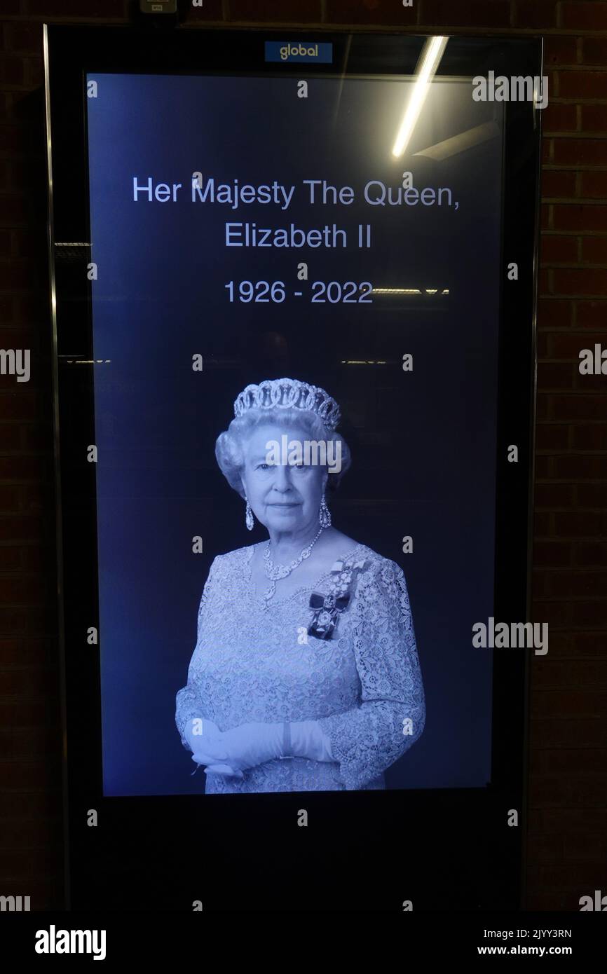 Digital advertising screen featuring Queen Elizabeth II following her ...