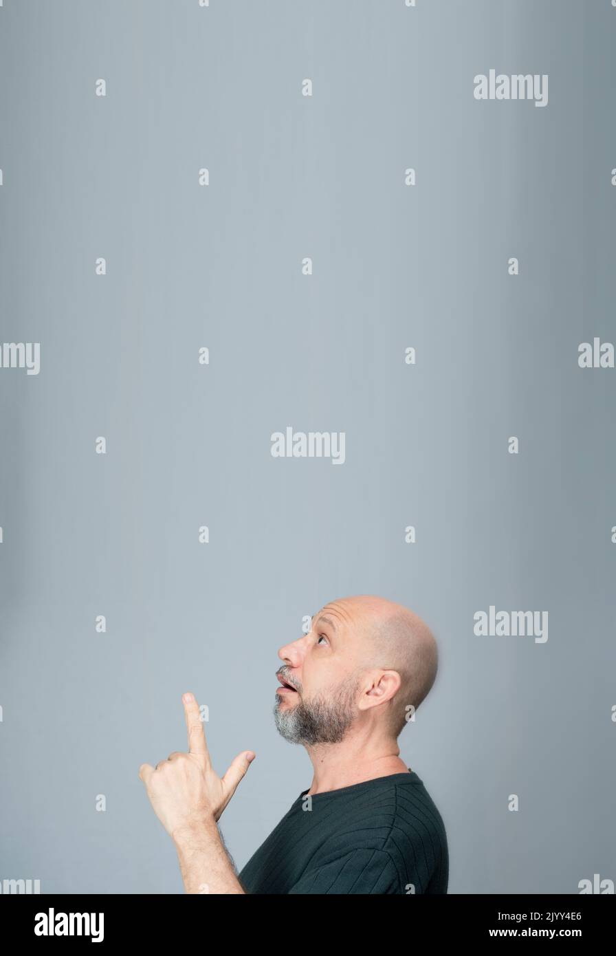Portrait of mature man standing on white background. Bald bearded man ...