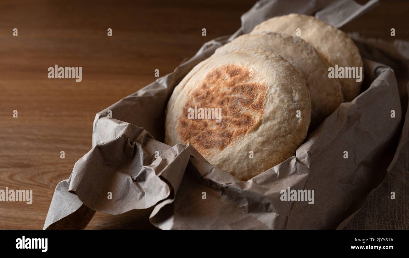 Traditional Portuguese bread Bolo Do Caco in craft paper Stock Photo ...