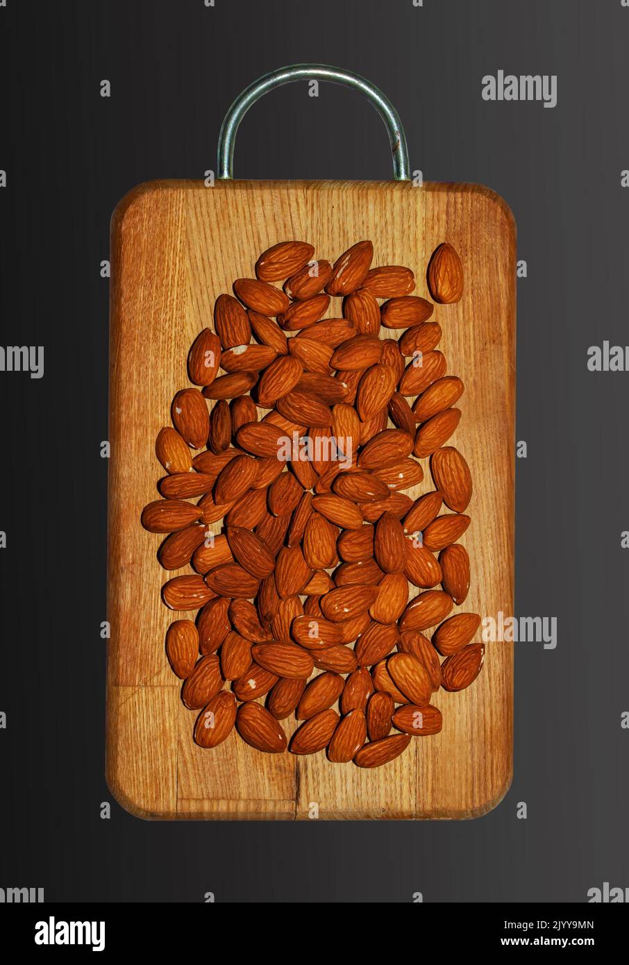 Almonds on a wooden board. Isolated on black background. Top view Stock ...