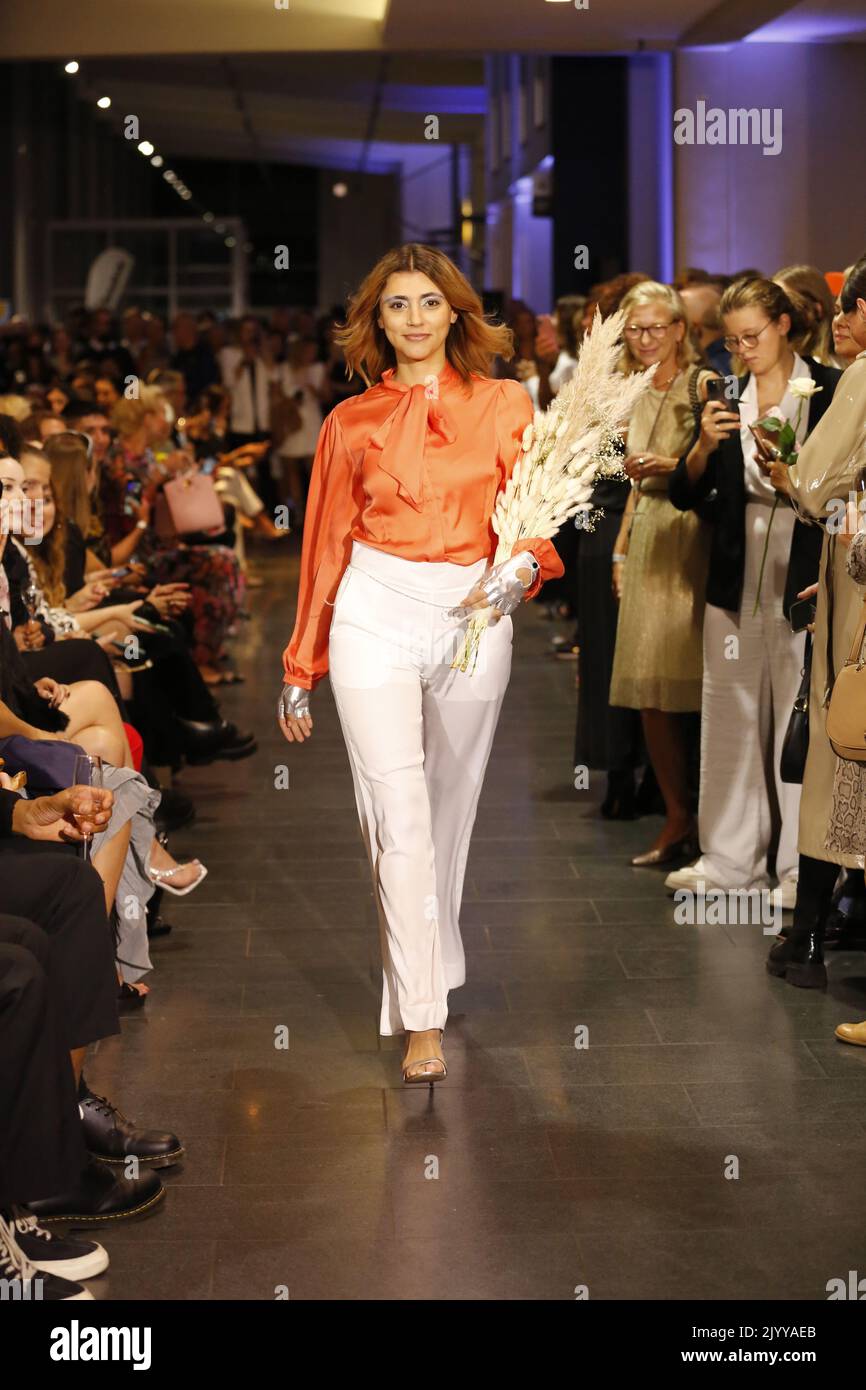 09/08/2022, Berlin, Germany, Models walk the runway at the Fashion show ...