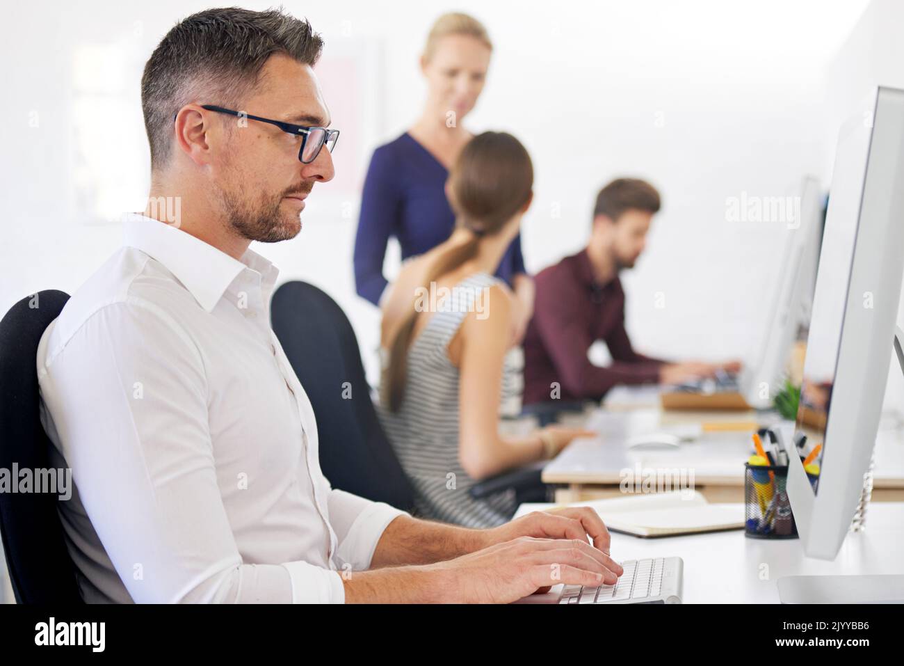 Male working on desktop computer hi-res stock photography and images ...